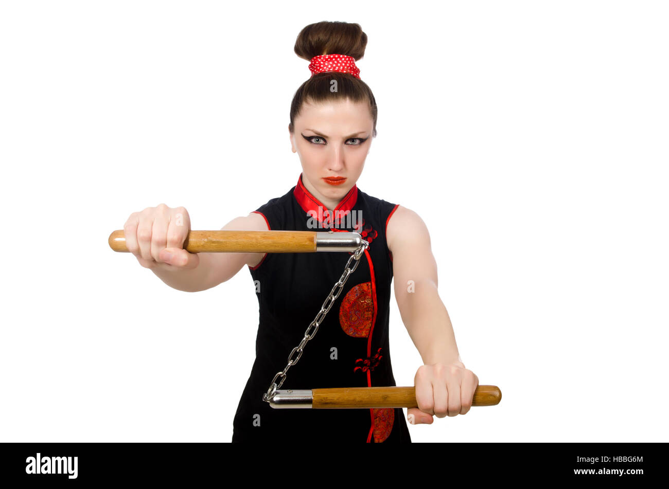 Funny woman with nunchucks isolated on white Stock Photo - Alamy