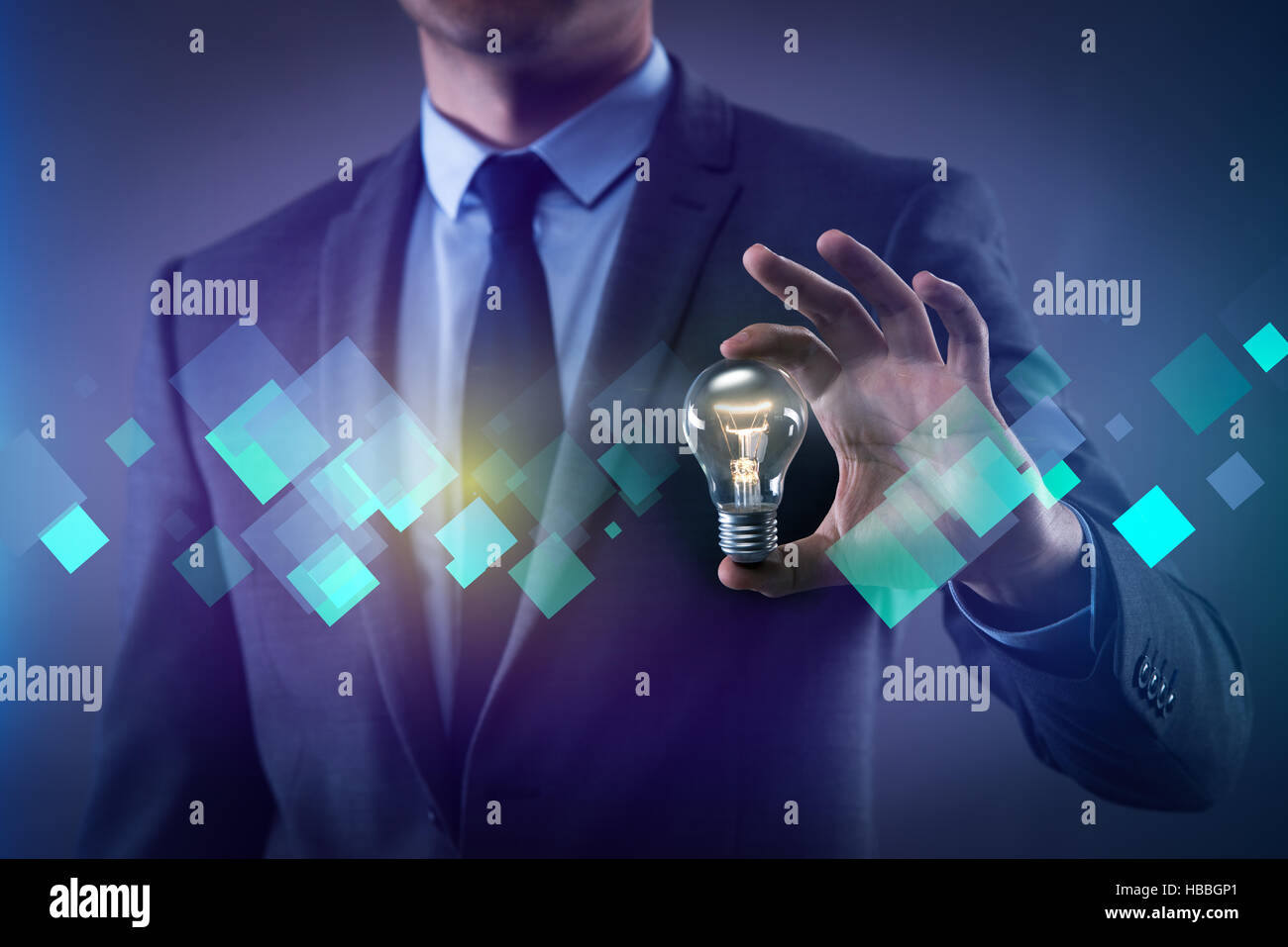 Man with light bulb lamp in concept Stock Photo - Alamy