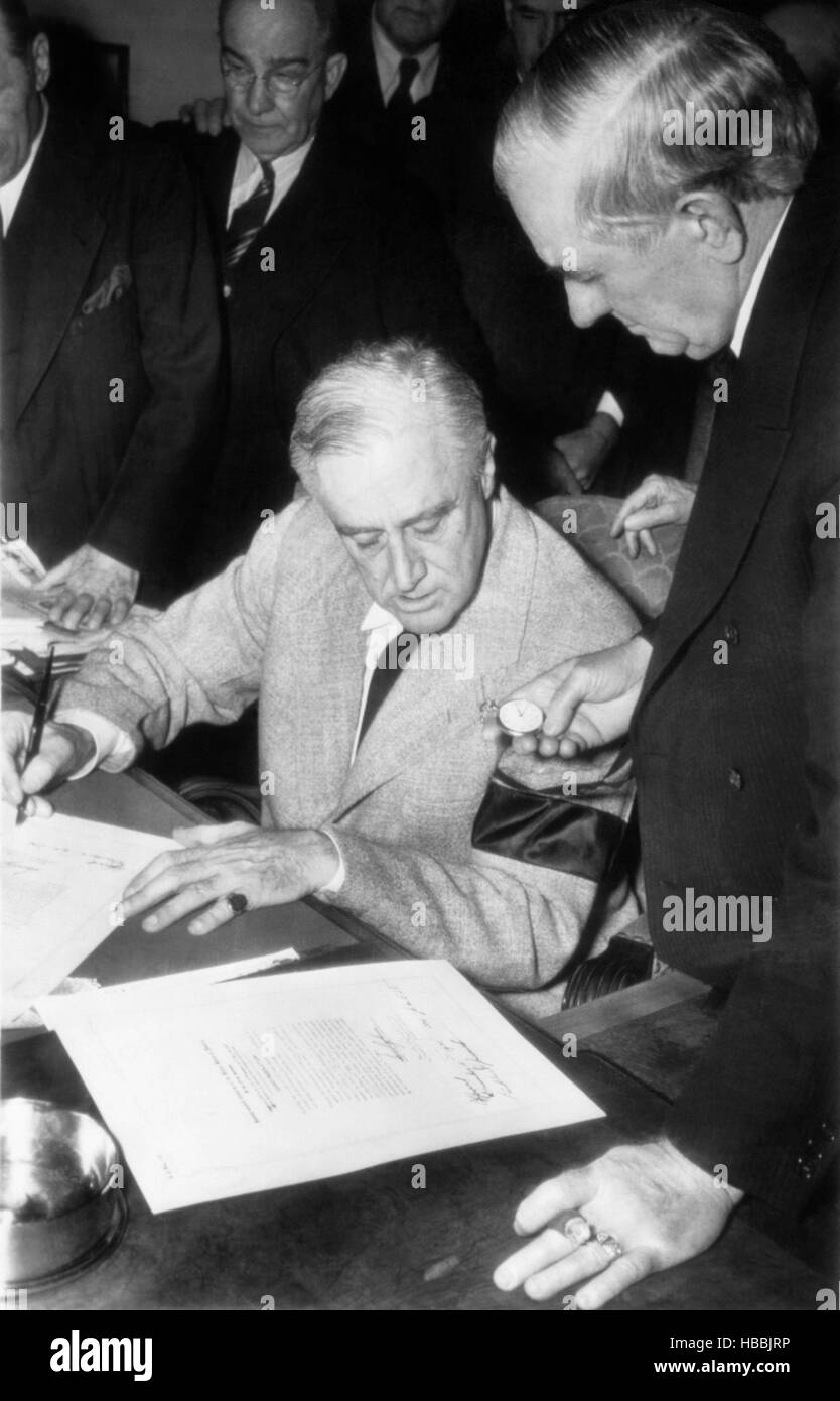 President Franklin D. Roosevelt (sitting), signing the declaration of ...