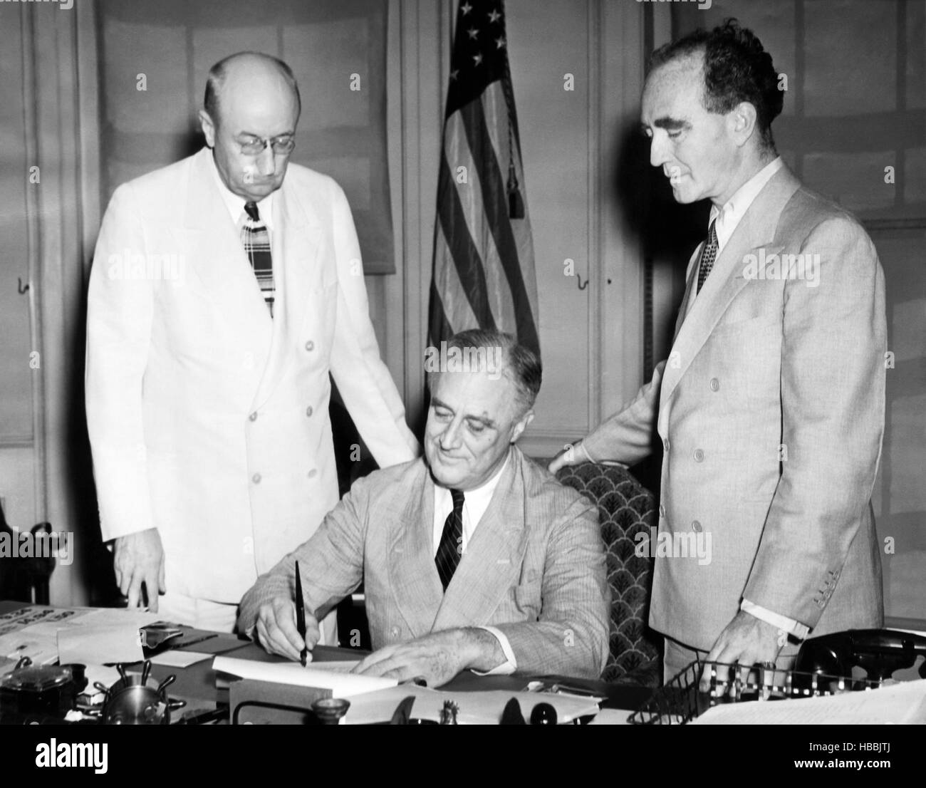 President Franklin D. Roosevelt (center), signing a court bill ...