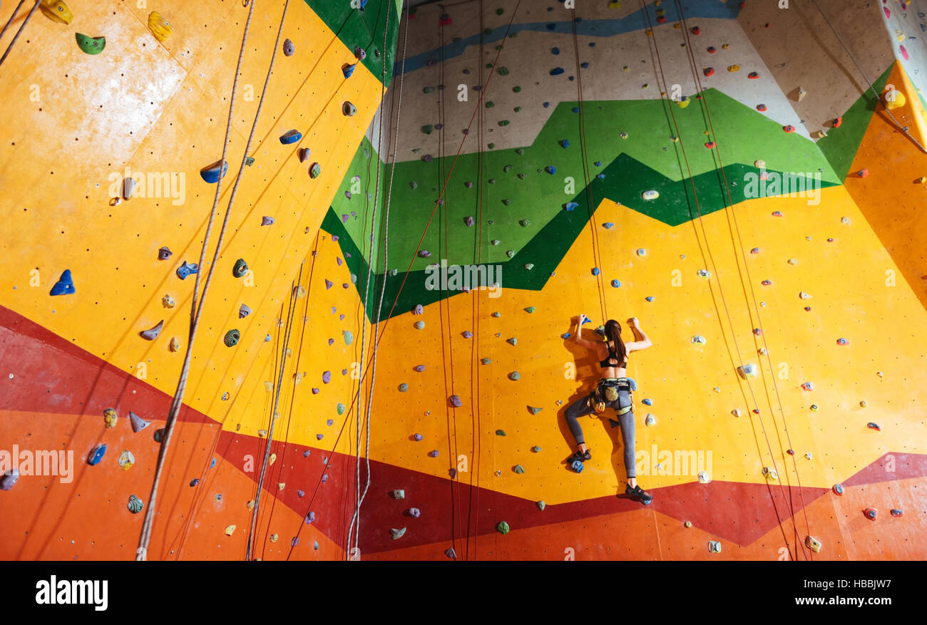 Woman climber in orange hi-res stock photography and images - Alamy