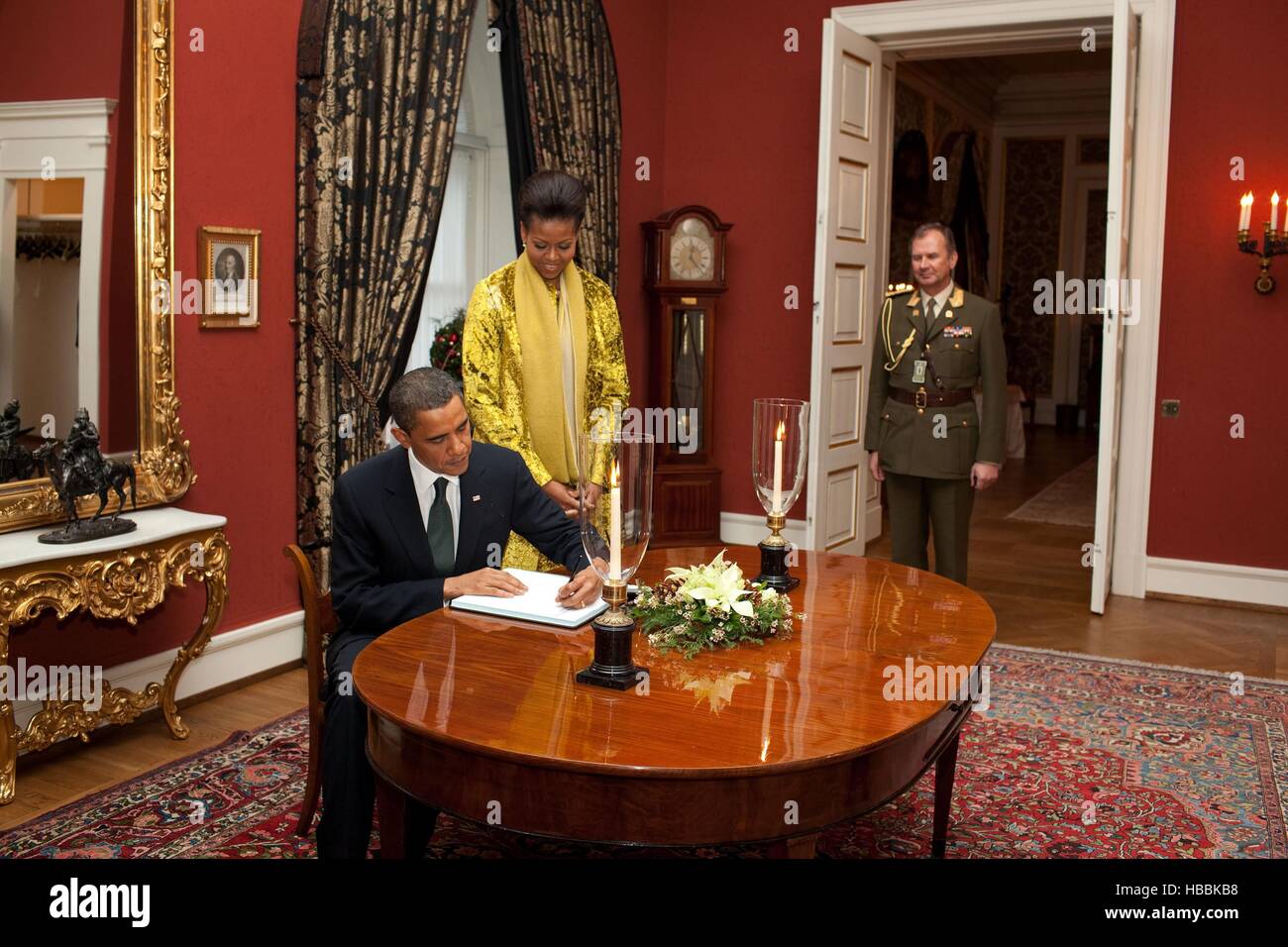 President Obama and Michelle Obama sign the guest book at Slottet Royal ...