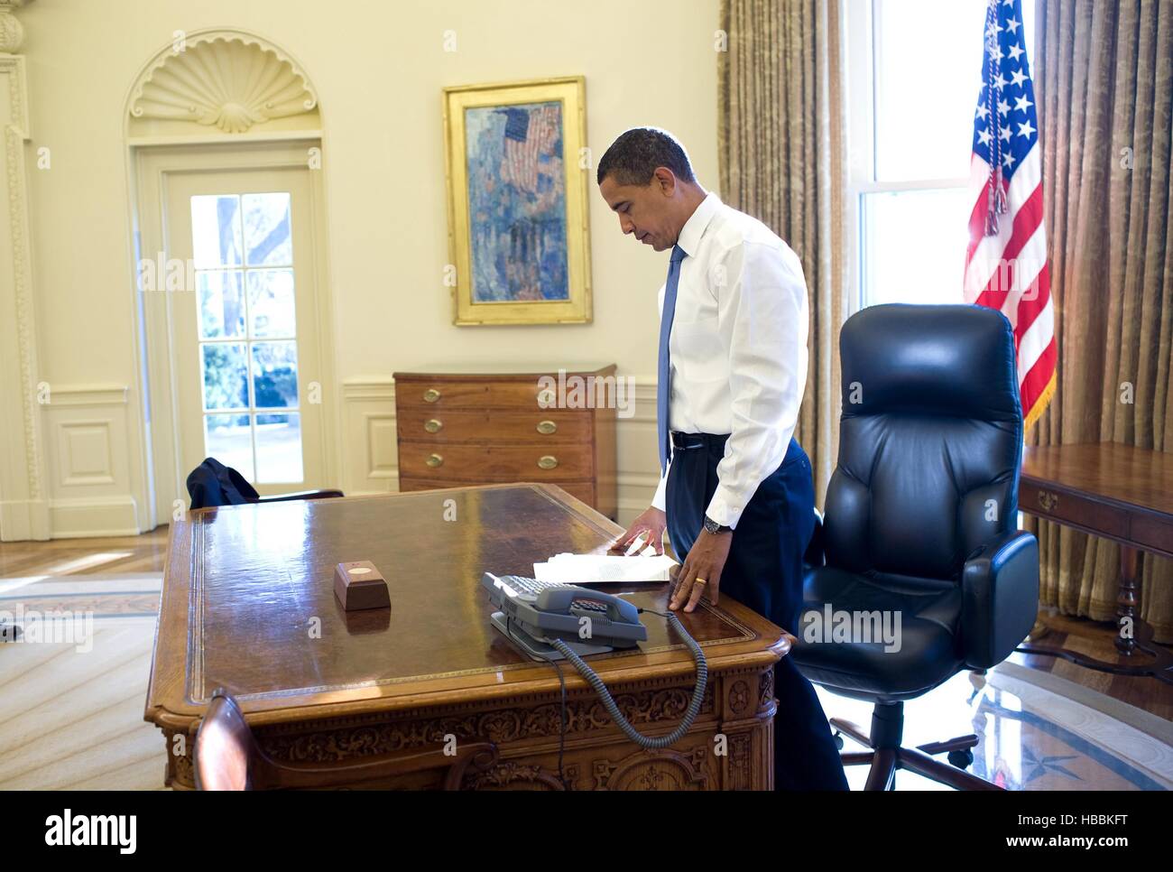 President Barack Obama on his first morning in the Oval Office as ...