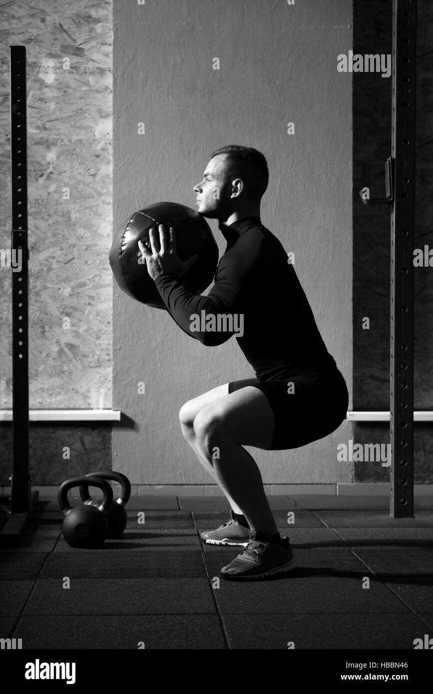 Squat Man High Resolution Stock Photography and Images - Alamy