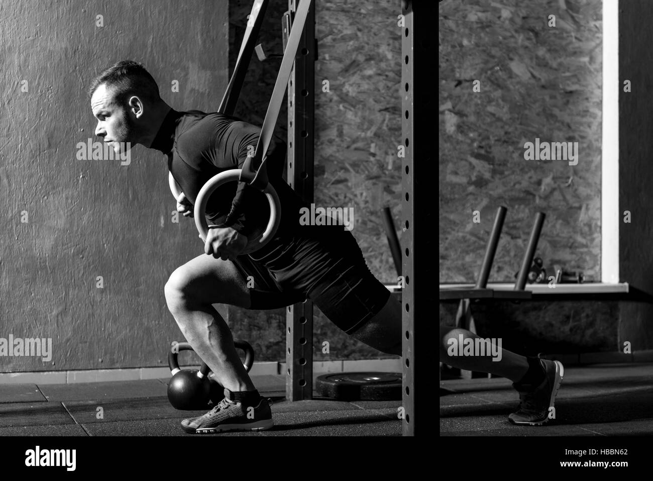 Healthy well built man exercising in the gym Stock Photo - Alamy