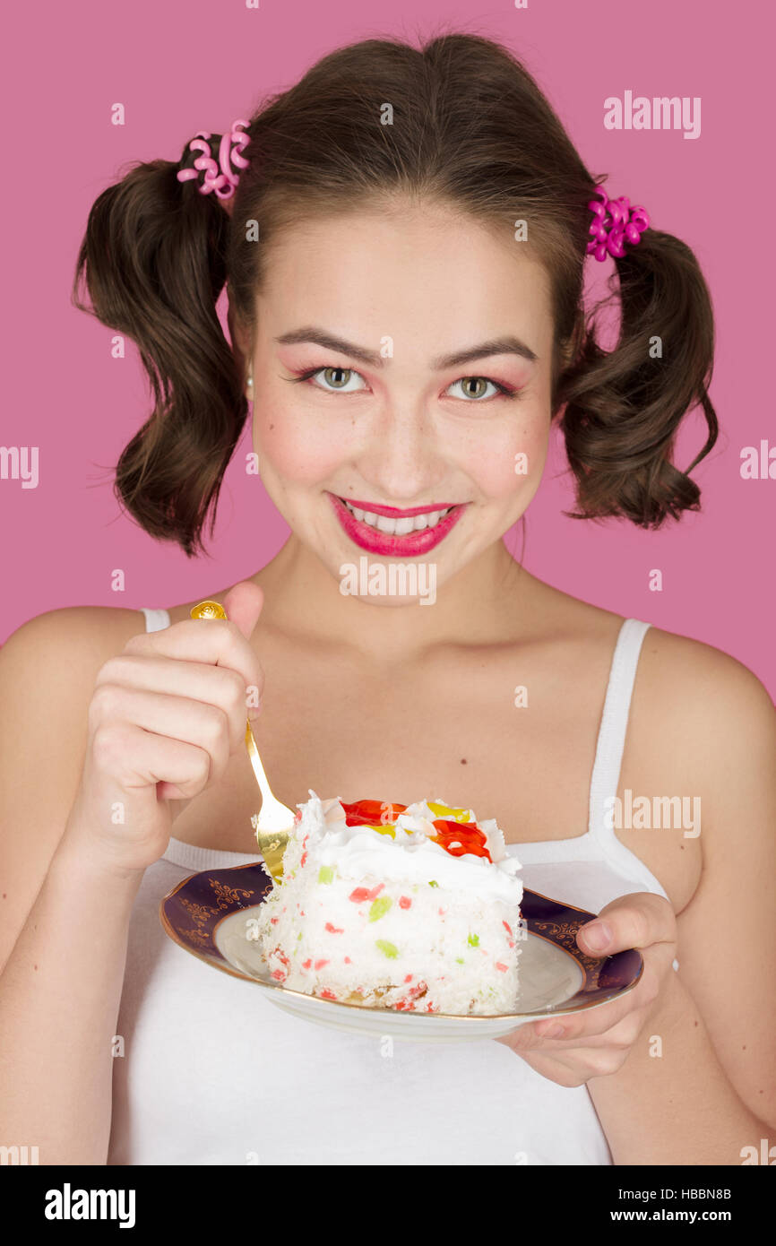 happy pretty girl with sweet dessert on pink background Stock Photo - Alamy