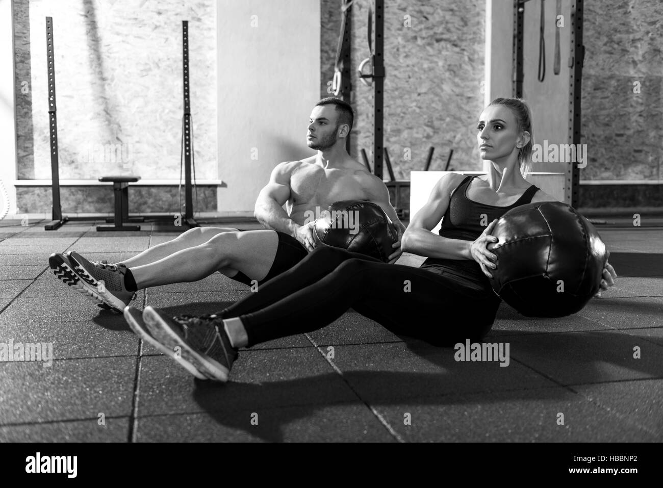 Pleasant good looking workout partners training together Stock Photo ...