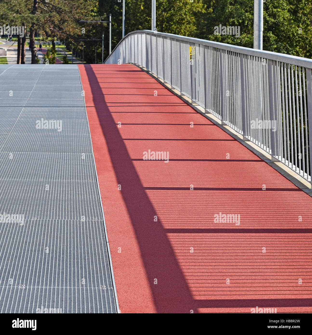 Running track on the pedestrian bridge next to a stadium Stock Photo ...