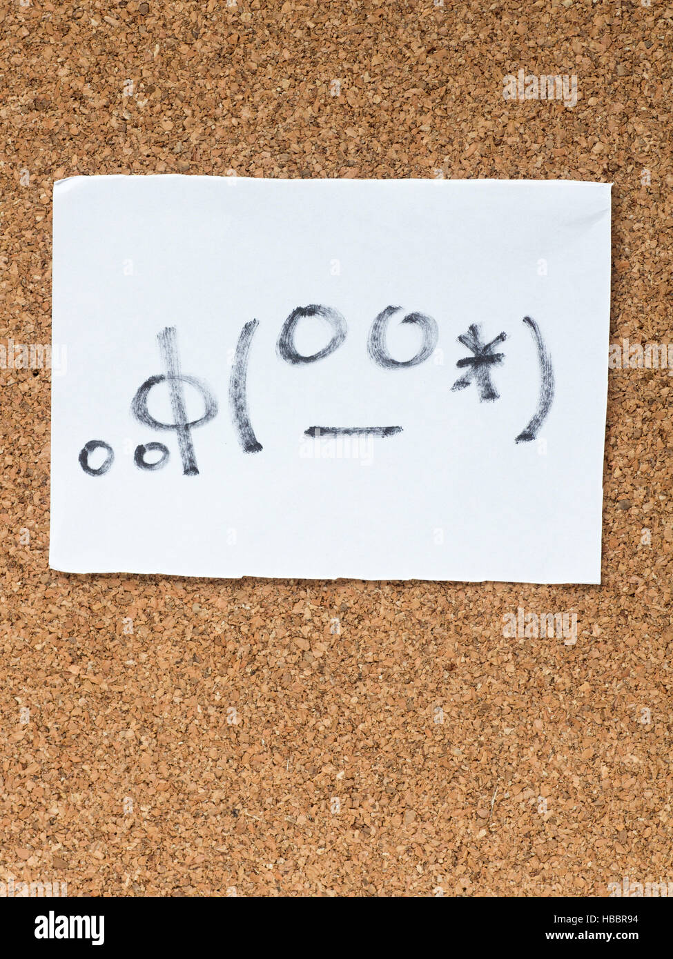 The series of Japanese emoticons called Kaomoji on the cork board ...
