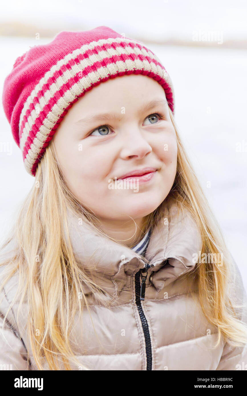Cute girl in red hat Stock Photo - Alamy
