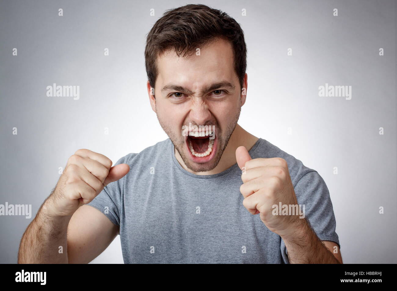 Young man shouting Stock Photo - Alamy