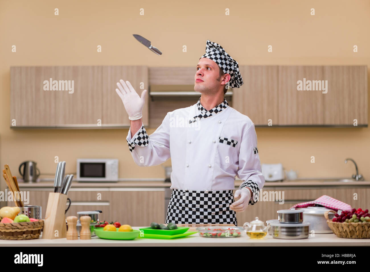 Male cook preparing food in the kitchen Stock Photo - Alamy