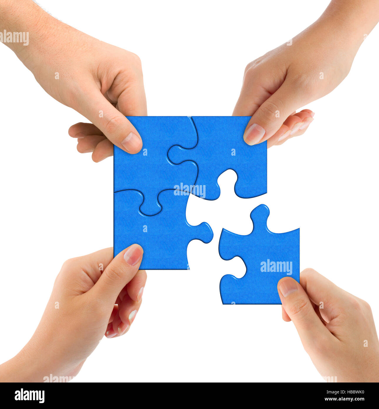 Hands and puzzle Stock Photo - Alamy
