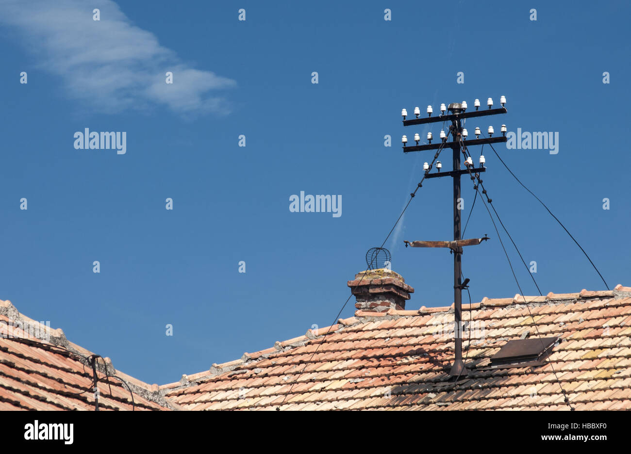 Electrical pillar on tiled roof Stock Photo - Alamy