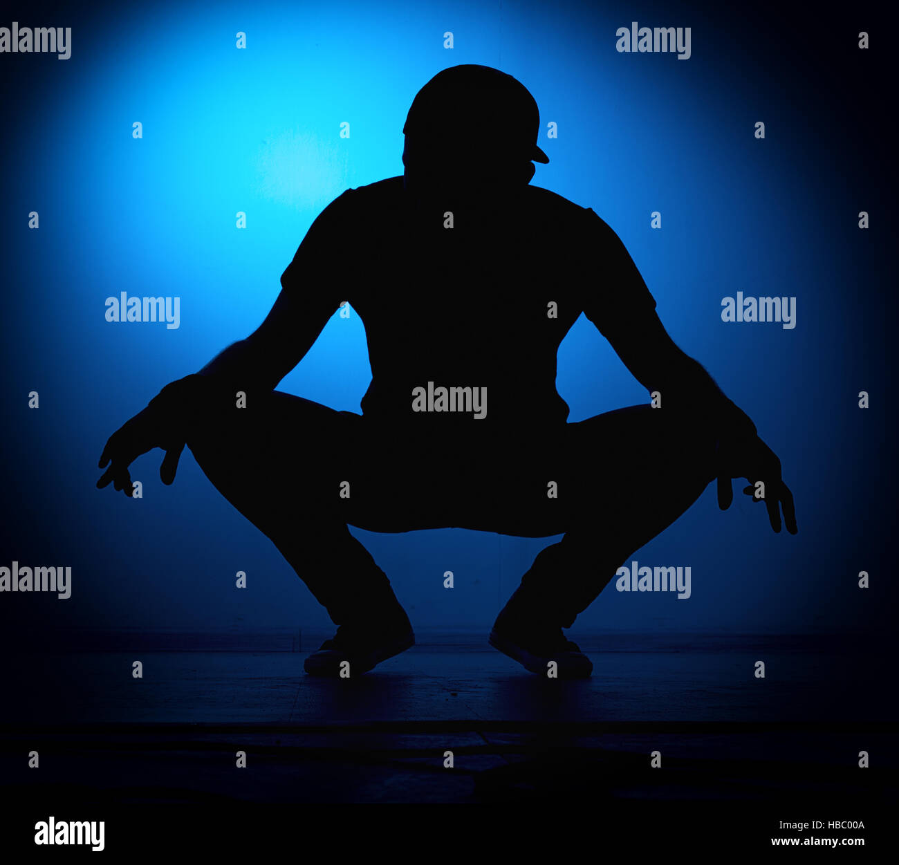 silhouette Rocker man posing on blue background Stock Photo - Alamy