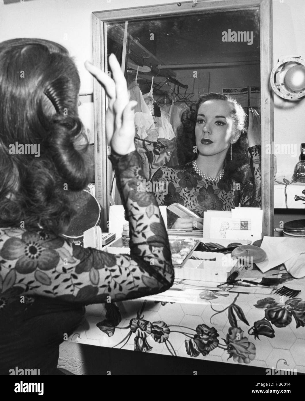 Broadway star Lisa Kirk applies a finishing touch in her dressing room ...