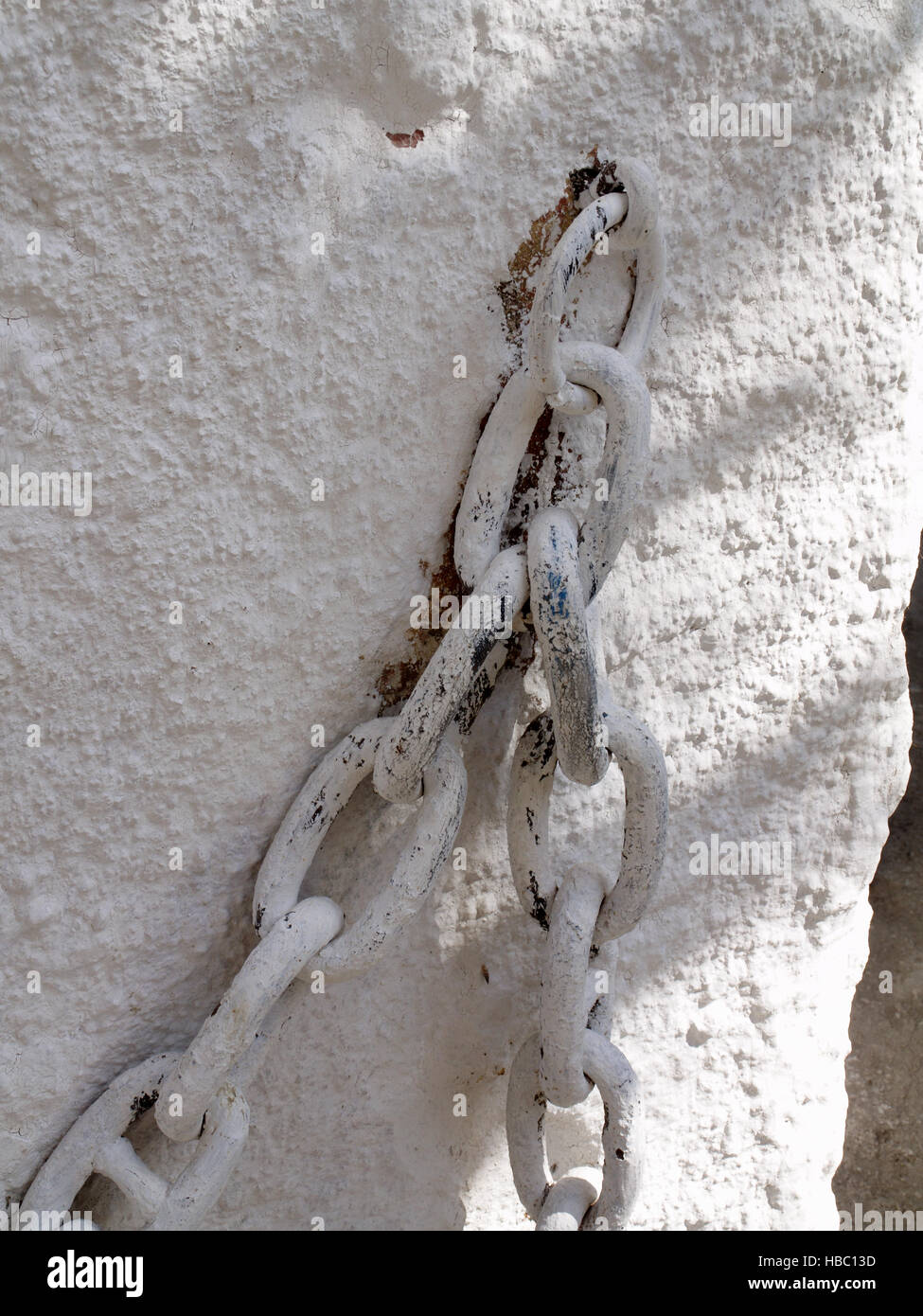 Close up of metal chain hanging on wall in Roda Corfu Greece Stock ...