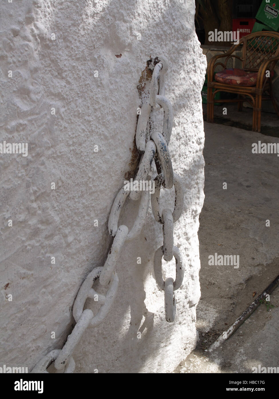 Close up of metal chain hanging on wall in Roda Corfu Greece Stock ...