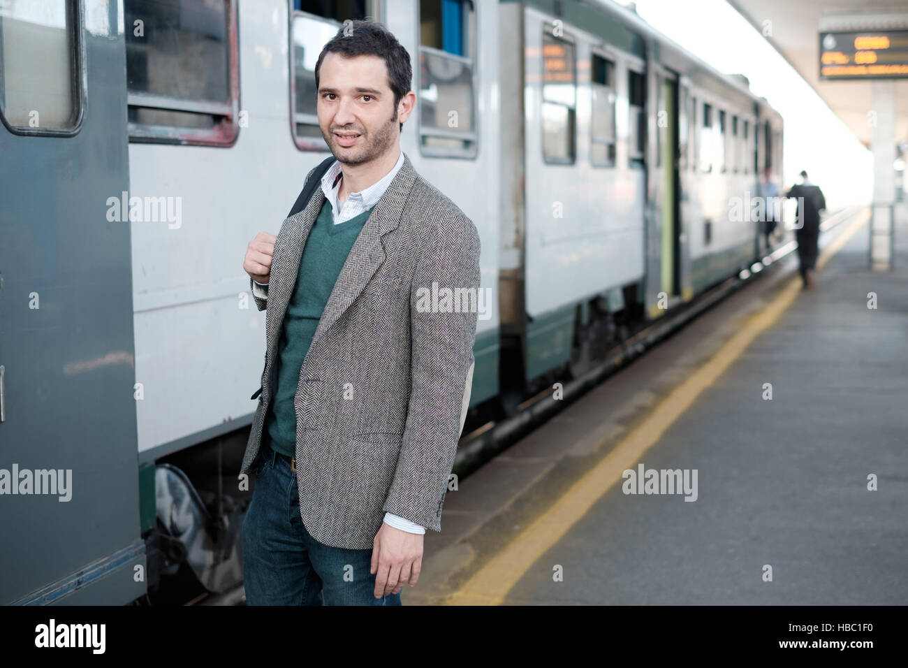 Man standing train station hi-res stock photography and images - Alamy