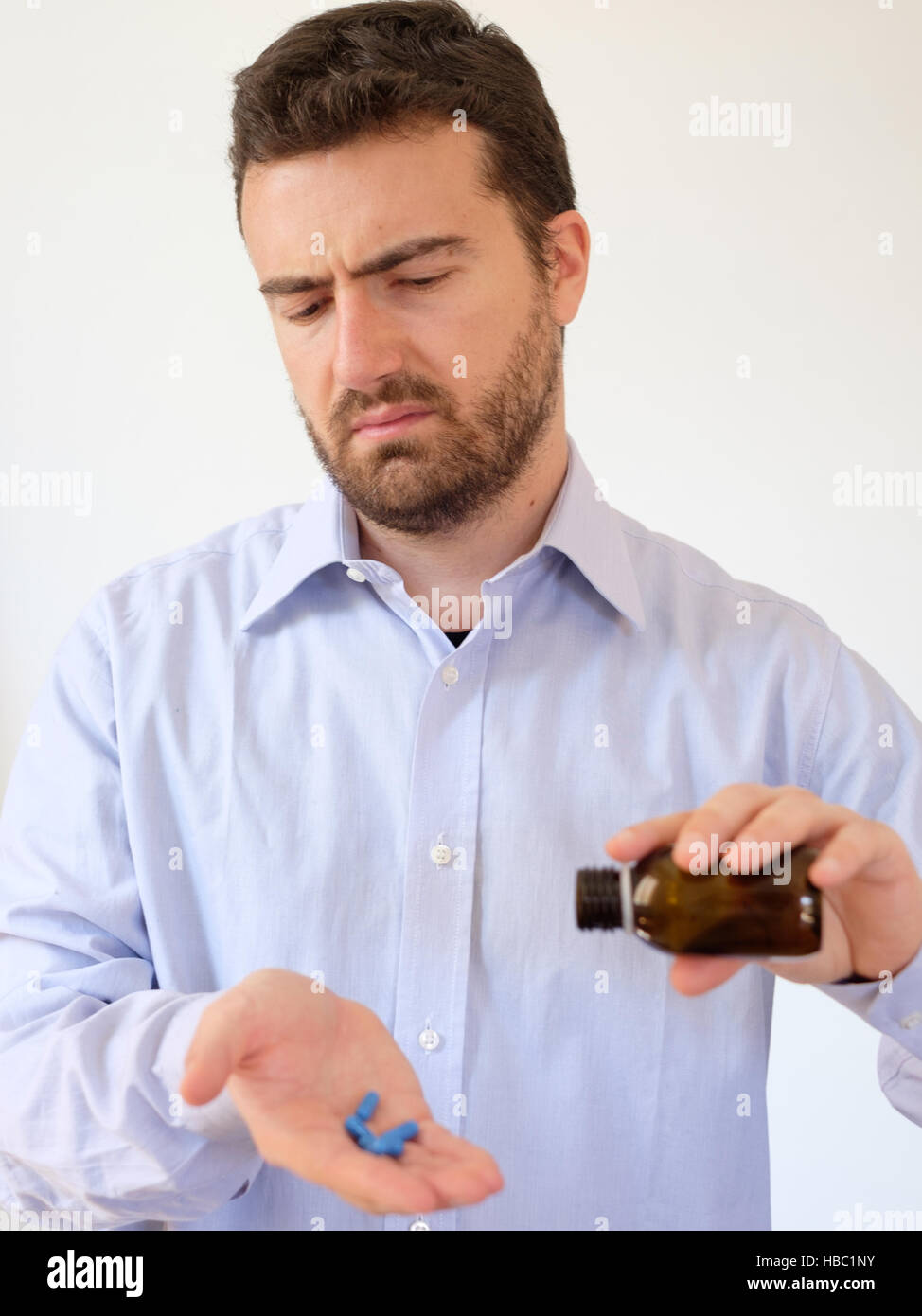White Male Taking Antibiotic High Resolution Stock Photography and ...