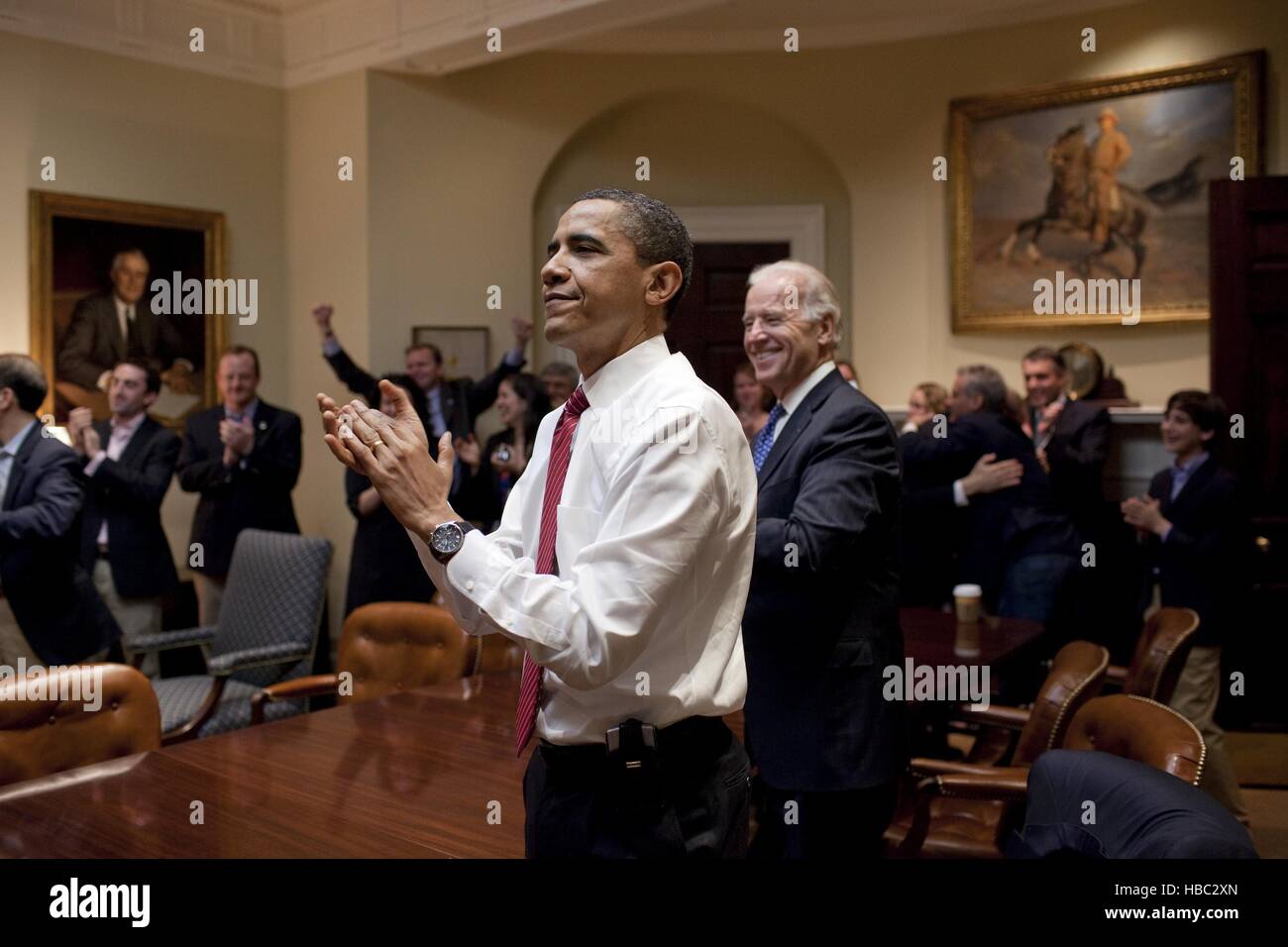 President Obama and VP Biden applaud as they watch the passage of the ...