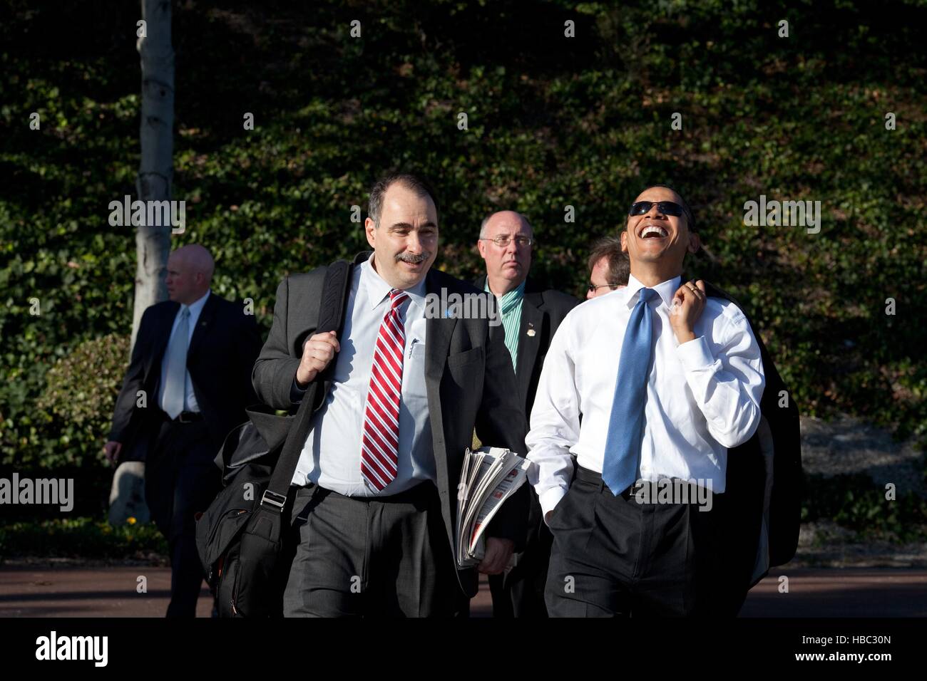 President Obama laughs while walking with Senior Advisor David Axelrod ...