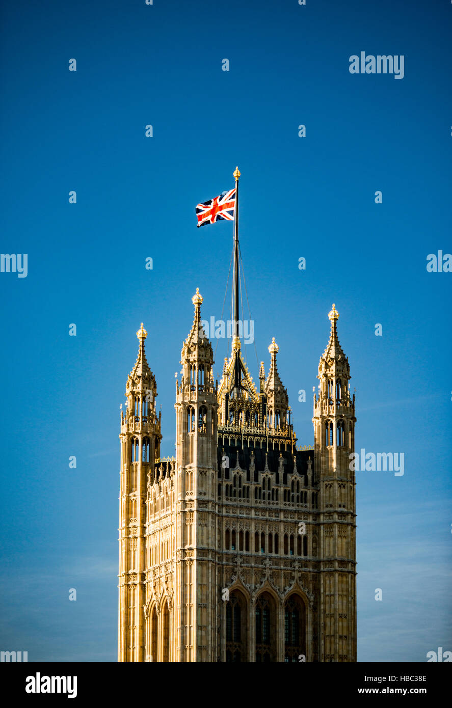 Victoria Tower, part of the Palace of Westminster, with a Union Jack on the flag pole Stock ...