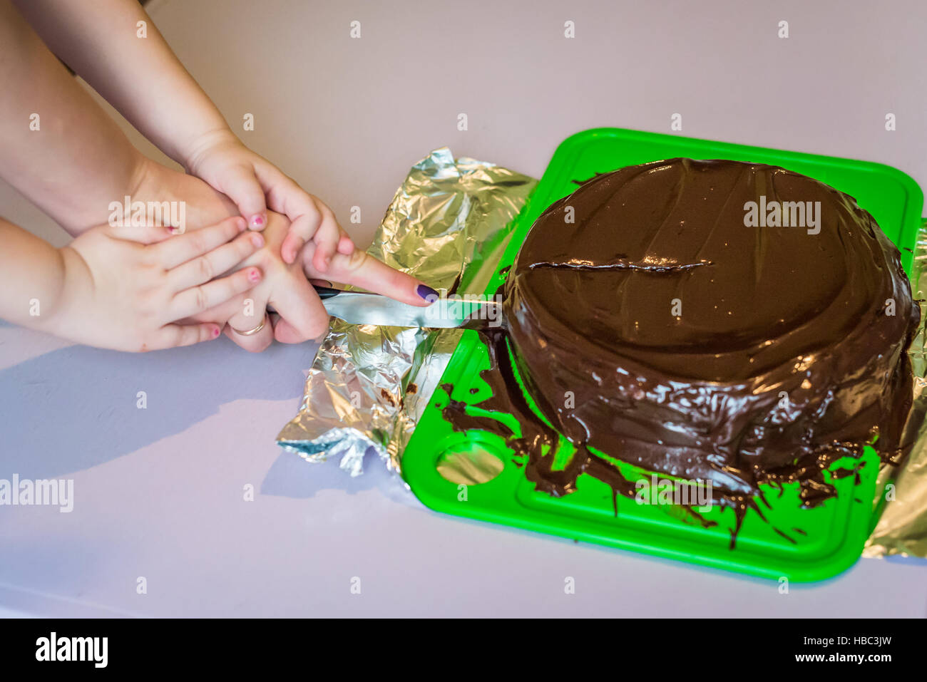 baby hands cut the cake Stock Photo - Alamy