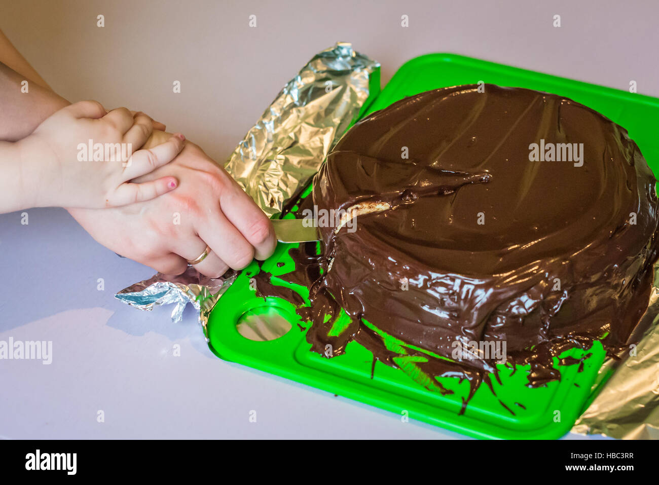 baby hands cut the cake Stock Photo - Alamy