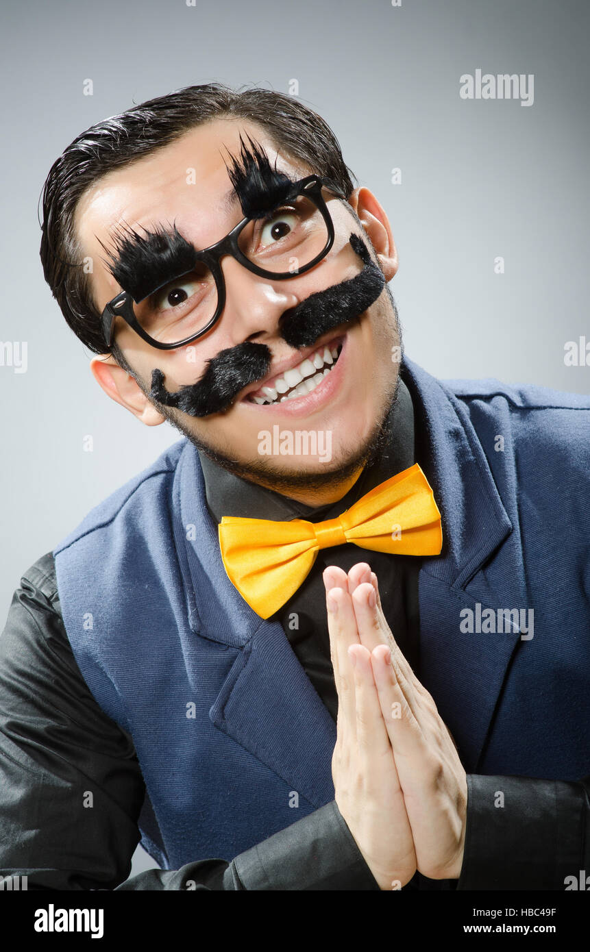 Funny man against dark background Stock Photo - Alamy
