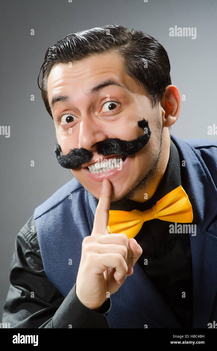 Funny man against dark background Stock Photo - Alamy