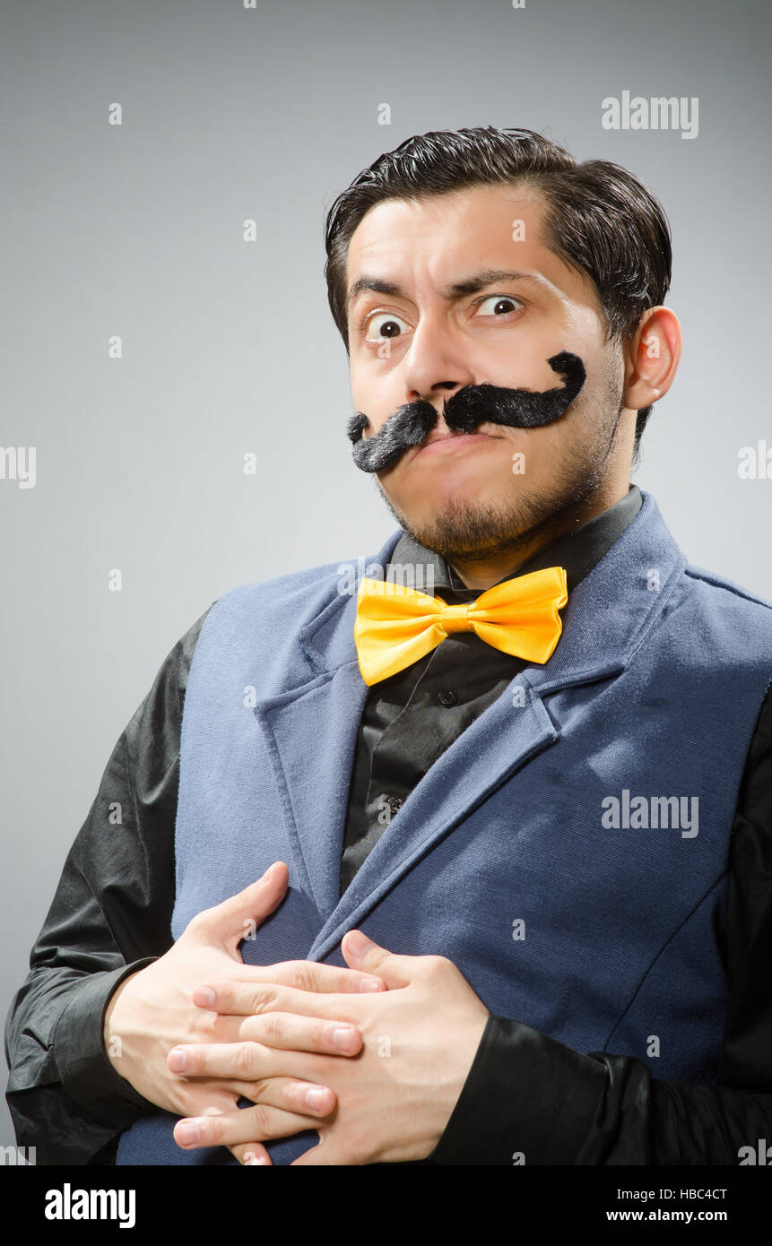 Funny man against dark background Stock Photo - Alamy