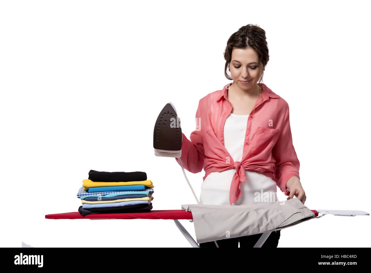Young woman doing ironing isolated on white Stock Photo - Alamy