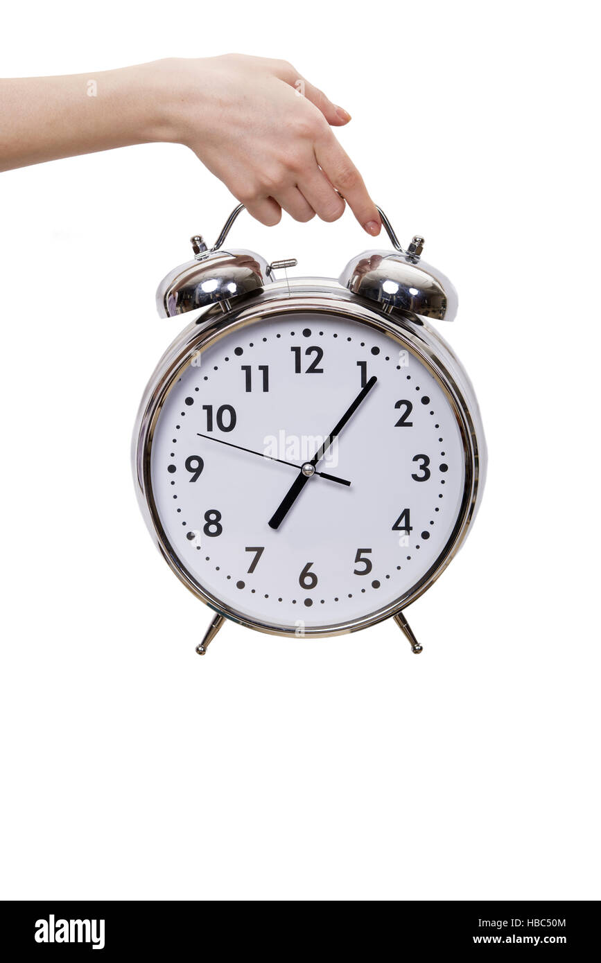Hand holding alarm clock isolated on white Stock Photo - Alamy
