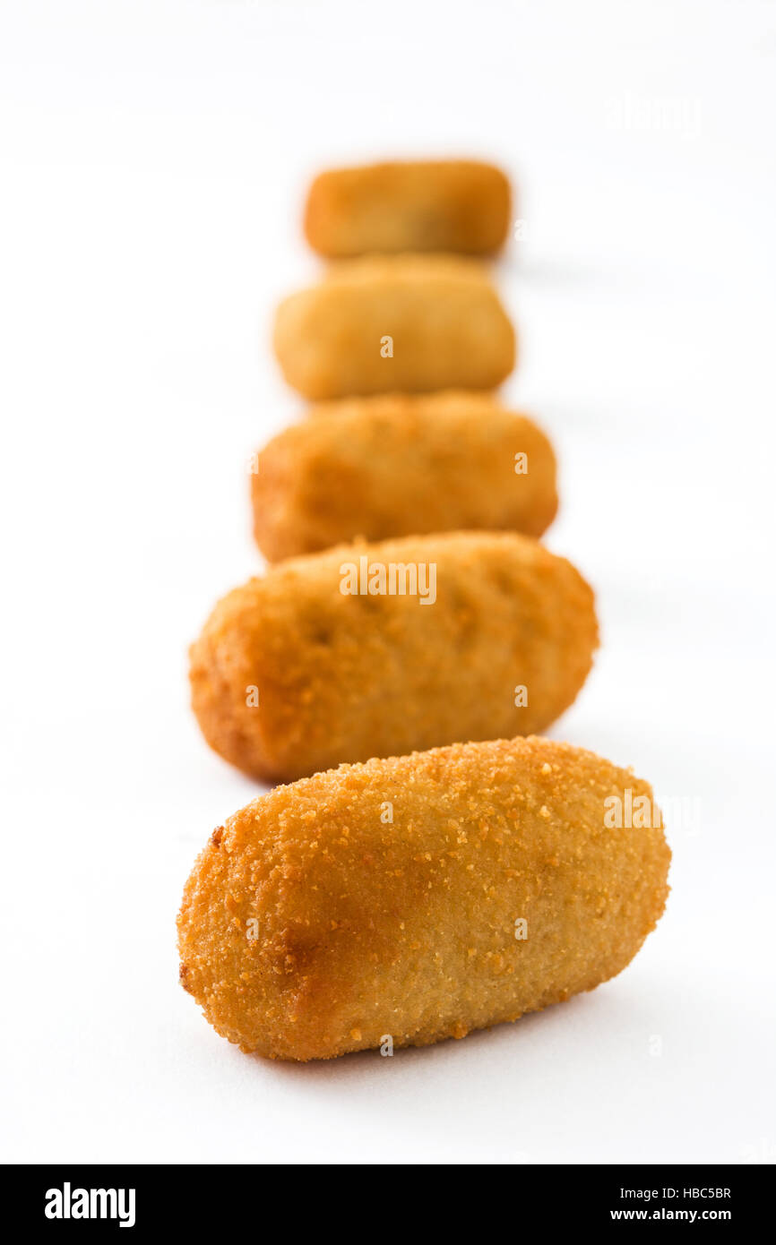 Traditional fried Spanish croquetas (croquettes) isolated on white ...