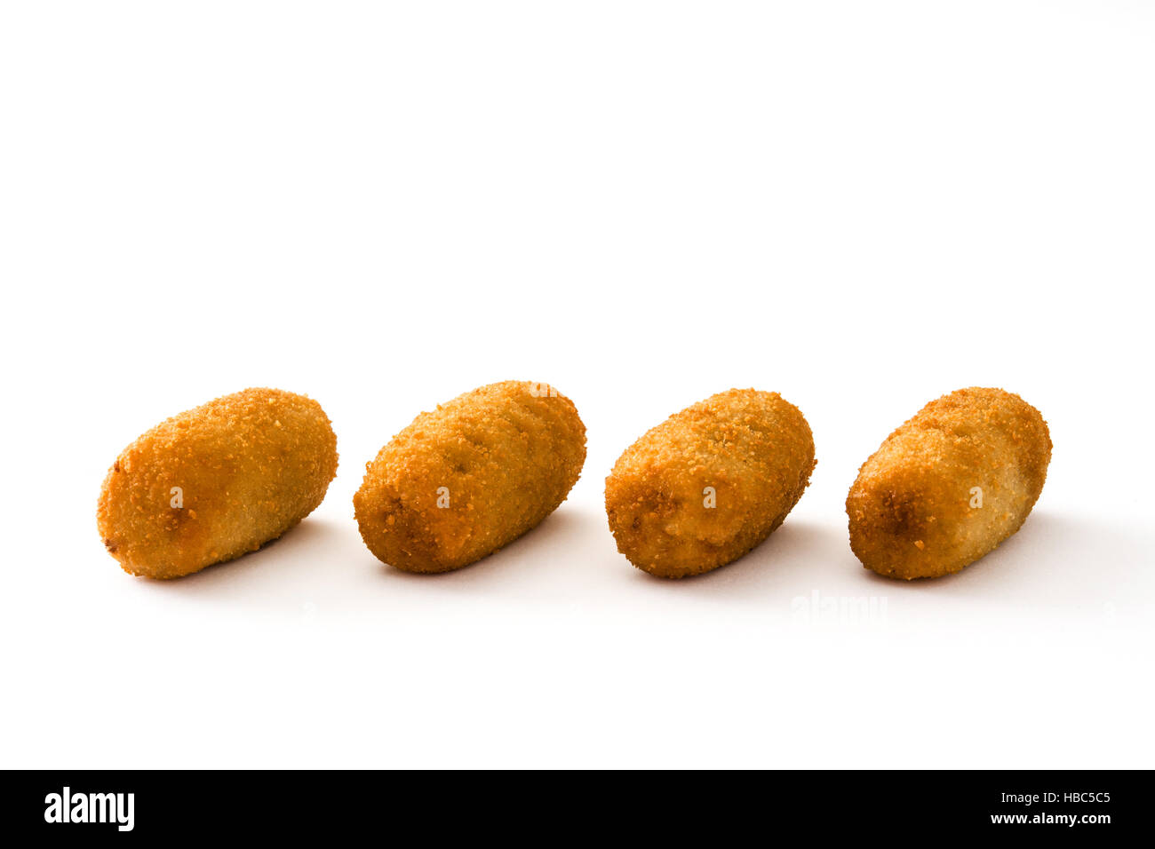 Traditional fried Spanish croquetas (croquettes) isolated on white ...