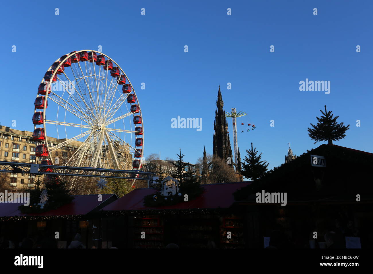 Ferris wheel, Scott Monument and Star Flyer ride Edinburgh Scotland ...