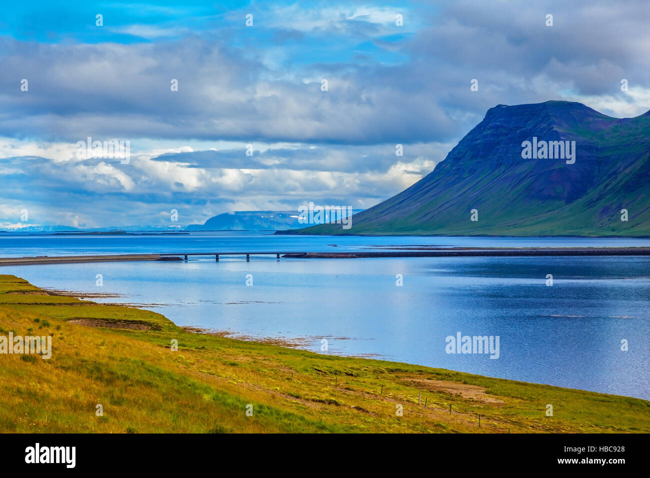 The cold fjord reflects clouds Stock Photo - Alamy
