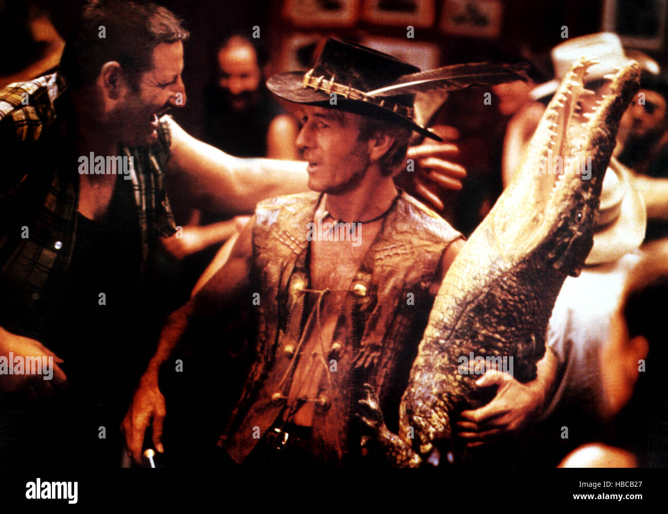 CROCODILE DUNDEE, Paul Hogan (holding crocodile), 1986, (c) Paramount ...