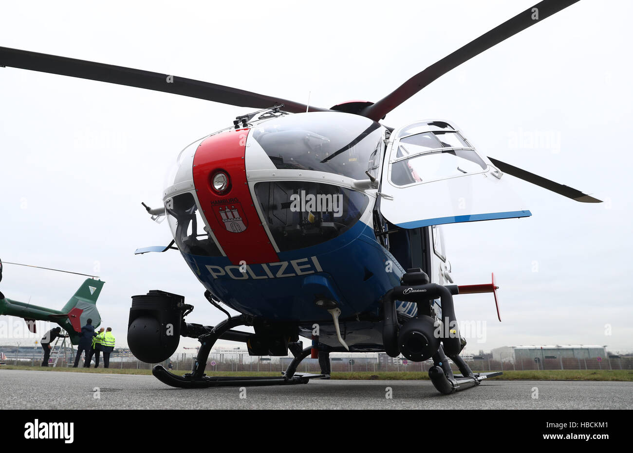 A police Eurocopter EC135 on a landing strip at Hamburg Airport in ...