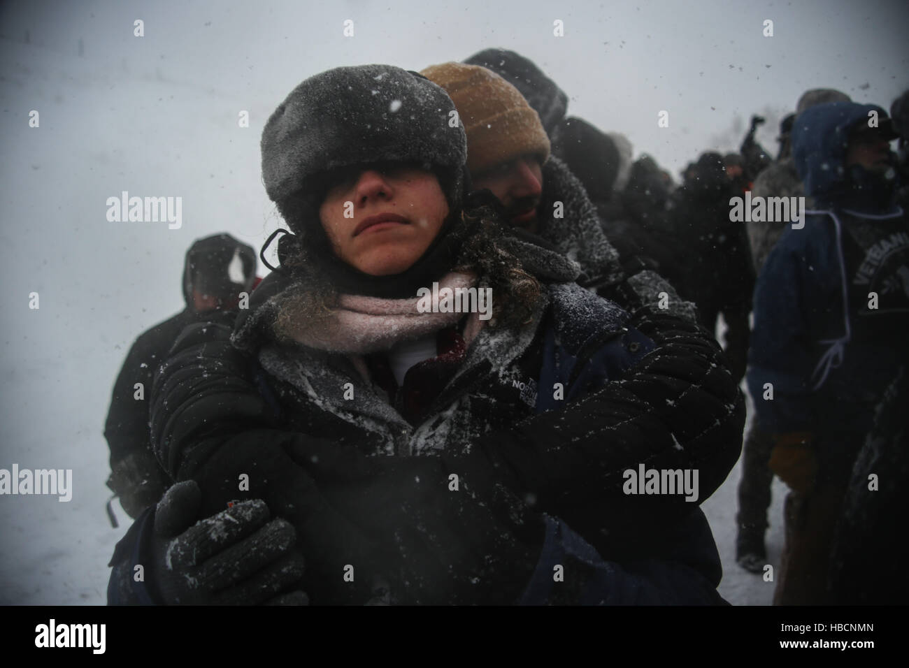 Cannon Ball, North Dakota, USA. 5th Dec, 2016. Water protectors embrace ...