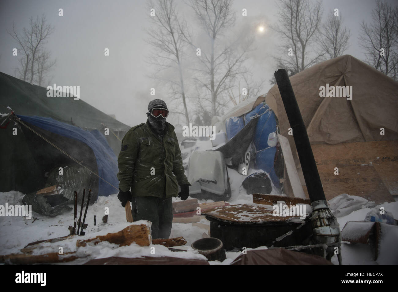 Cannon Ball, North Dakota, USA. 6th Dec, 2016. A water protector burns ...