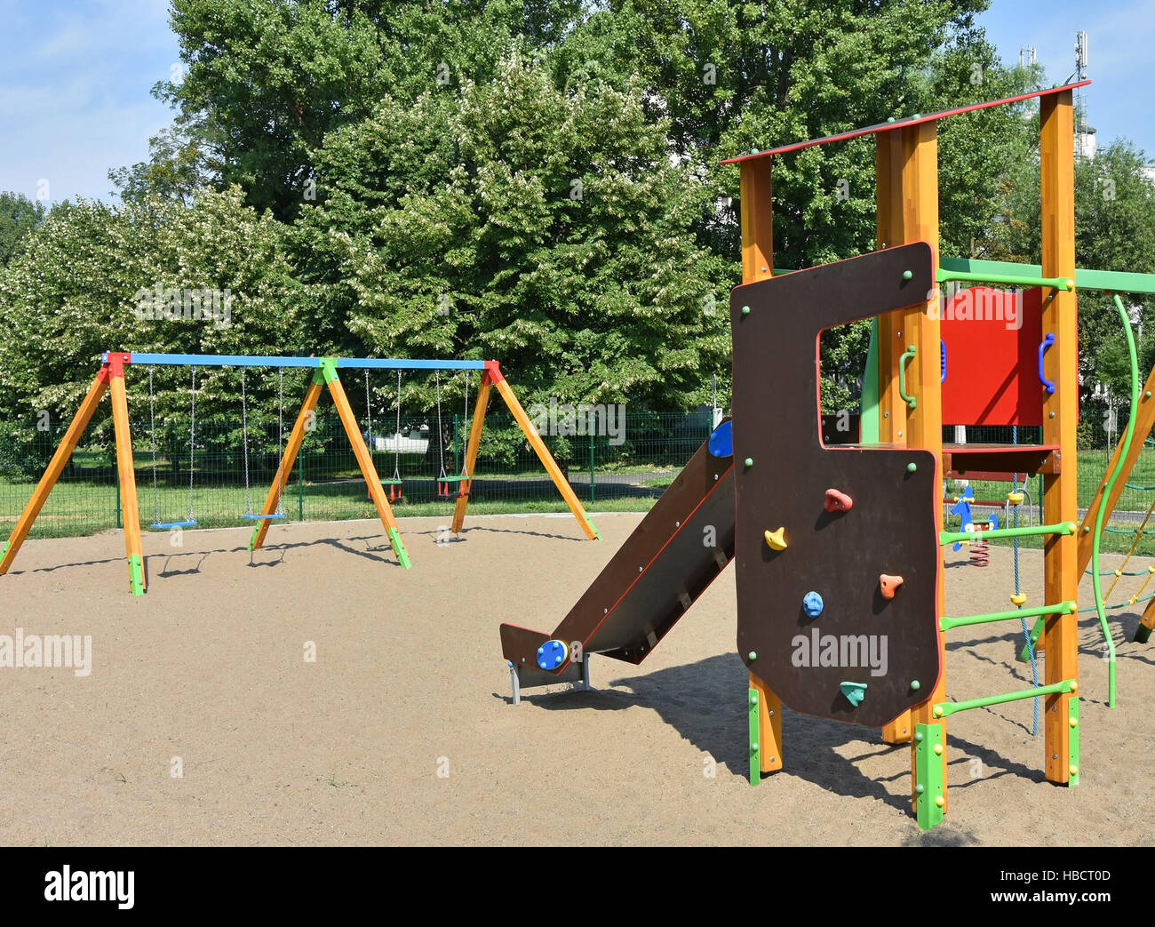 Jungle gym and swing at the playground in the city Stock Photo - Alamy