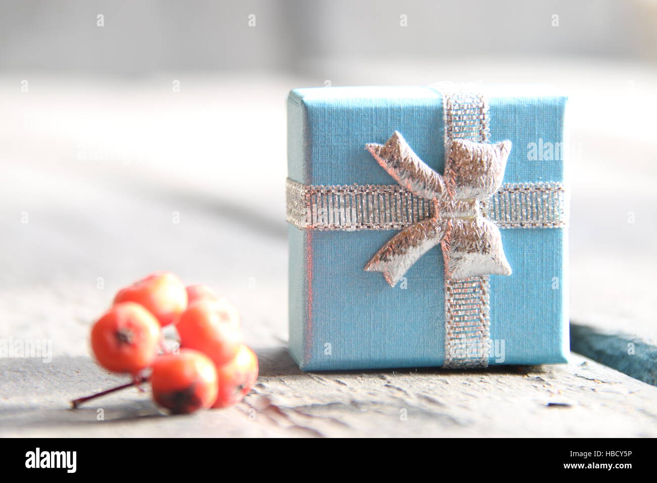 Rowan branch and gift. Merry Christmas card Stock Photo - Alamy