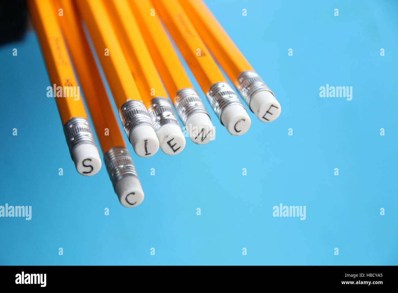 science, inscription on pencil, blue background Stock Photo - Alamy