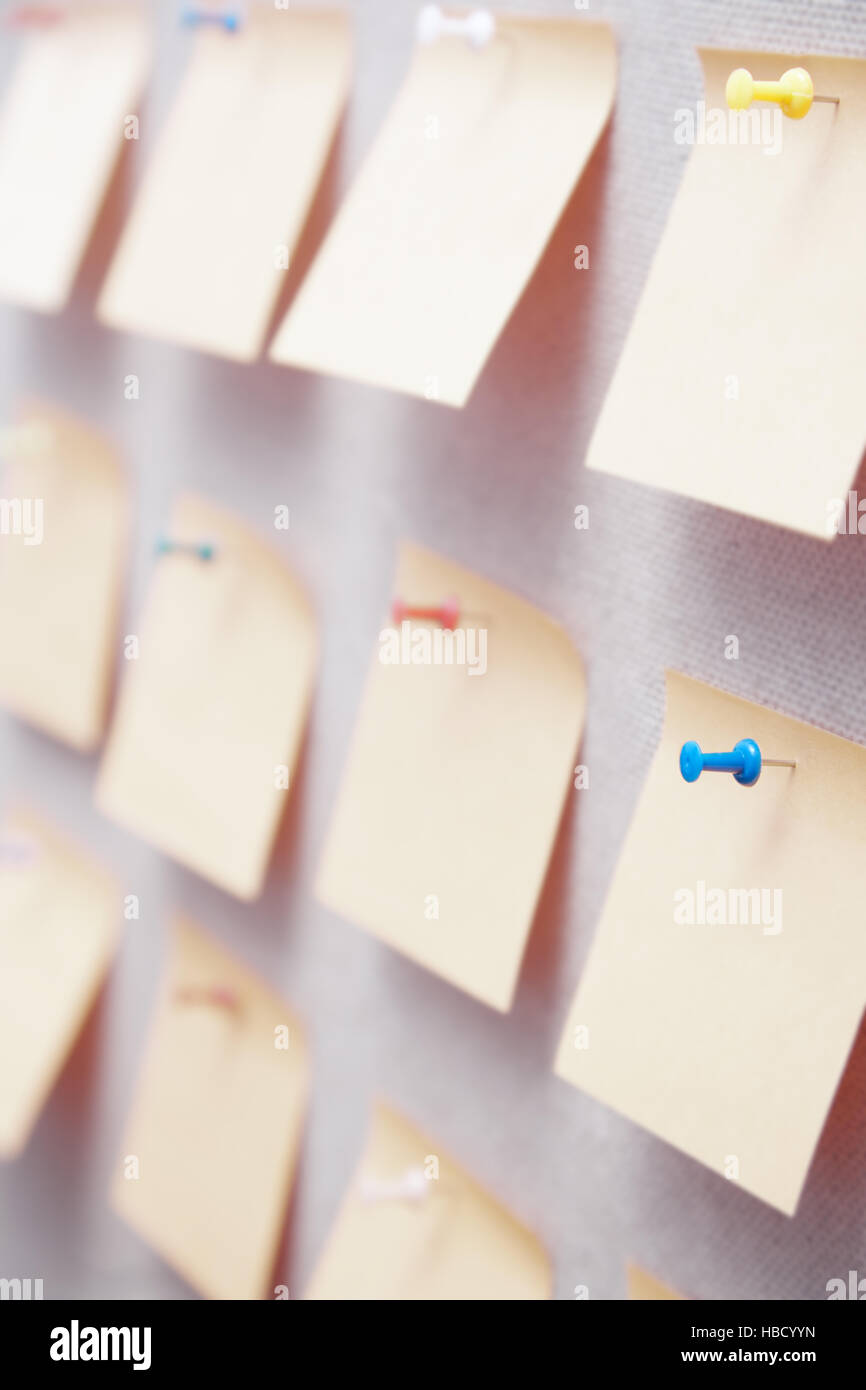 Sticky notes on a bulletin board Stock Photo - Alamy