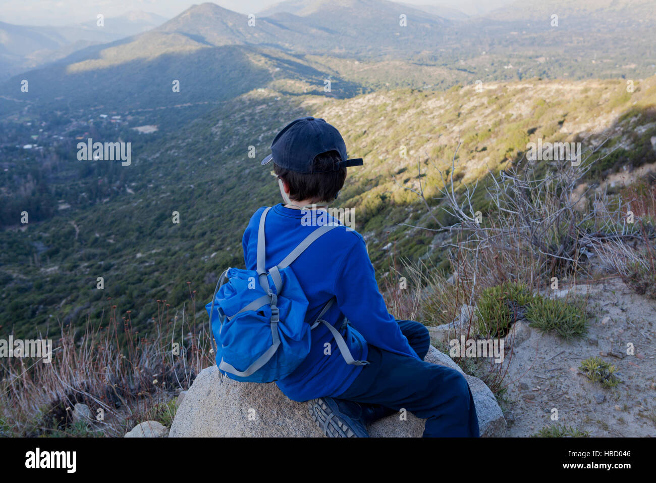 One boy sitting out not participating hi-res stock photography and ...