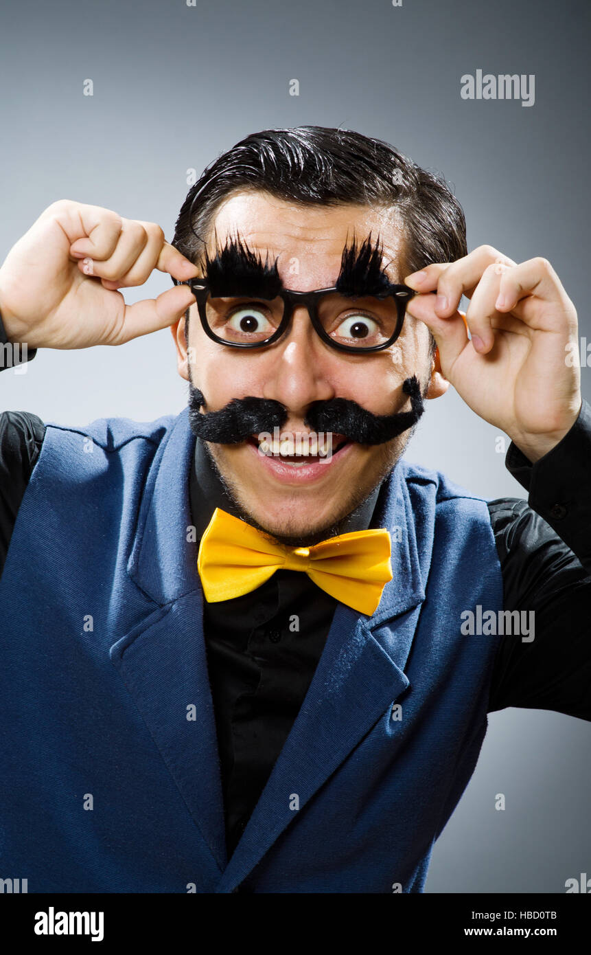 Funny man against dark background Stock Photo - Alamy