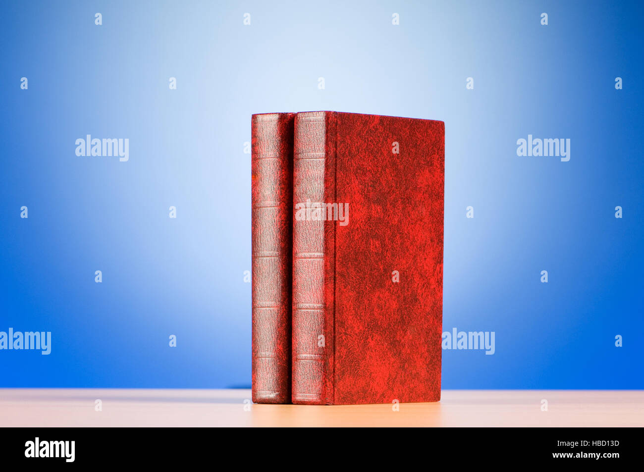 Education concept with red cover books Stock Photo - Alamy