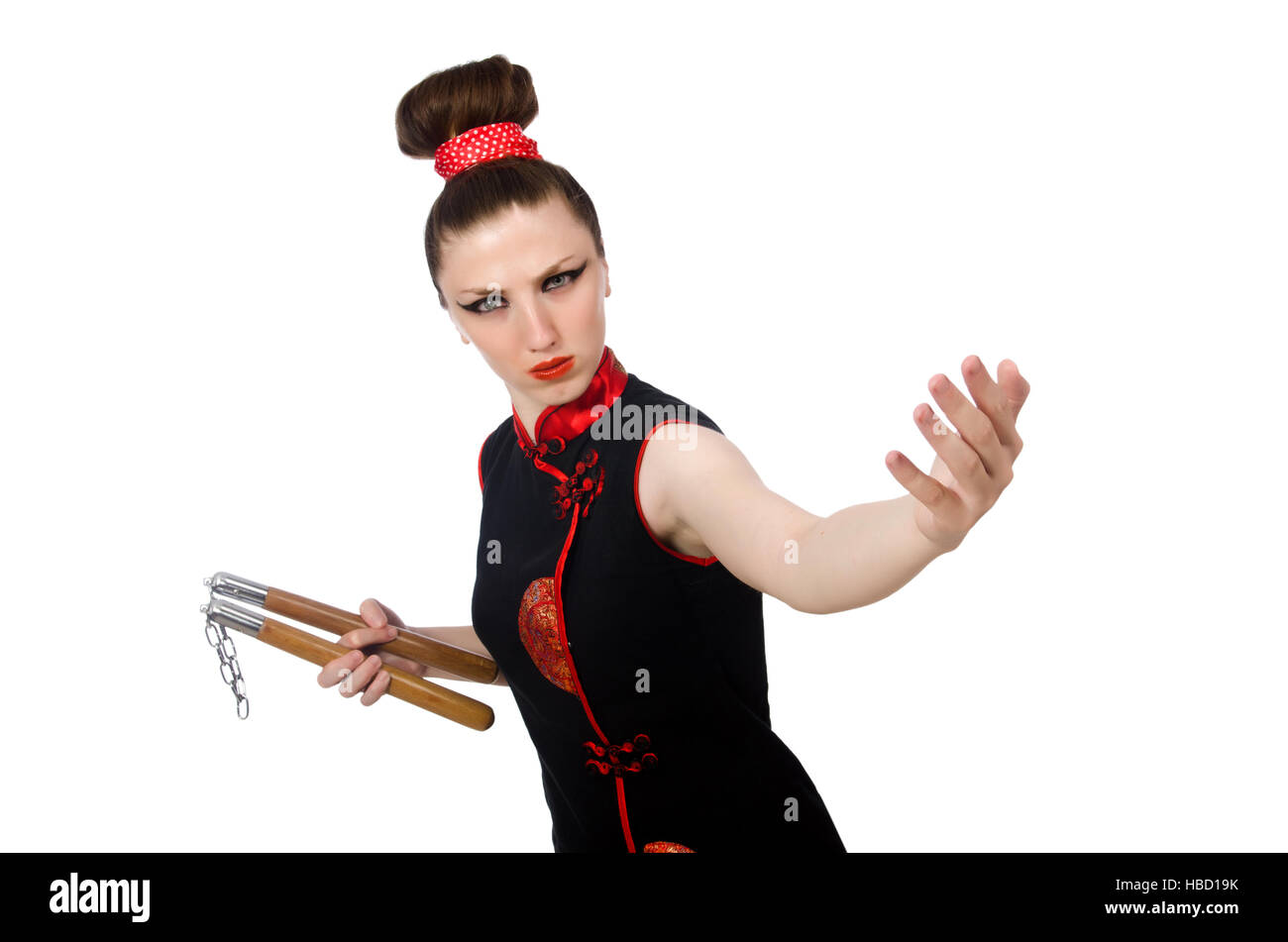 Funny woman with nunchucks isolated on white Stock Photo - Alamy